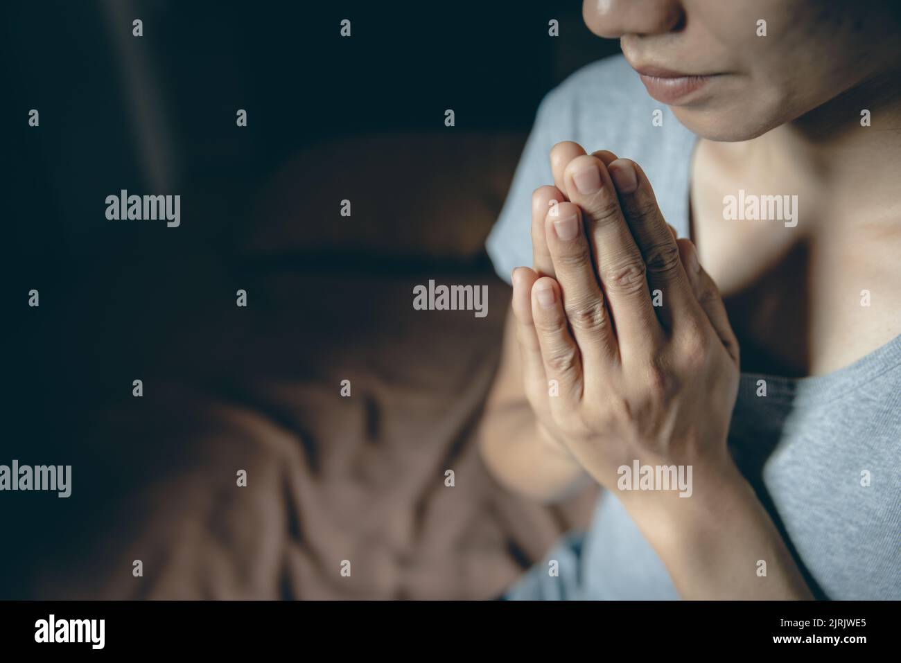 woman Praying hands with faith in religion and belief in God On the ...