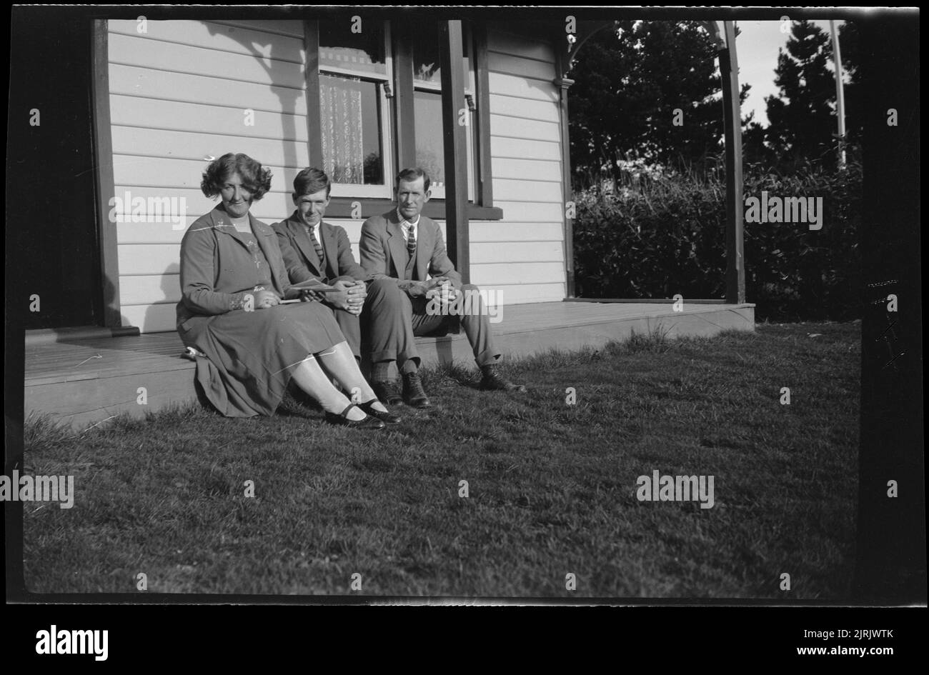 Group seated on porch hi-res stock photography and images - Alamy