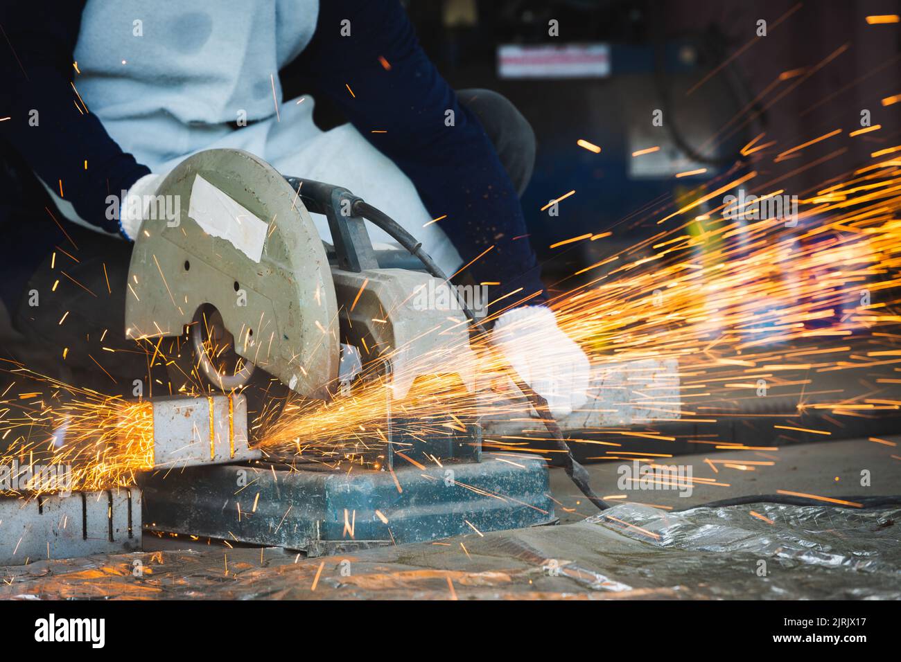 Cutting of a steel with splashes of sparks, Industrial grinder with ...