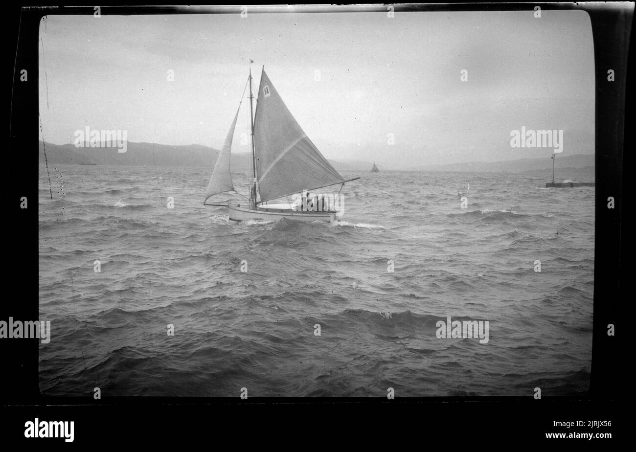 Yacht, Wellington harbour, 1920s to 1930s, by Roland Searle Stock Photo ...