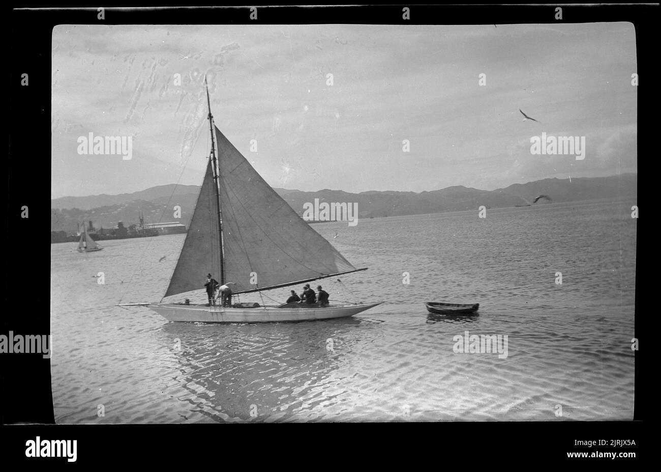Yacht, Wellington harbour, 1920s to 1930s, by Roland Searle Stock Photo ...