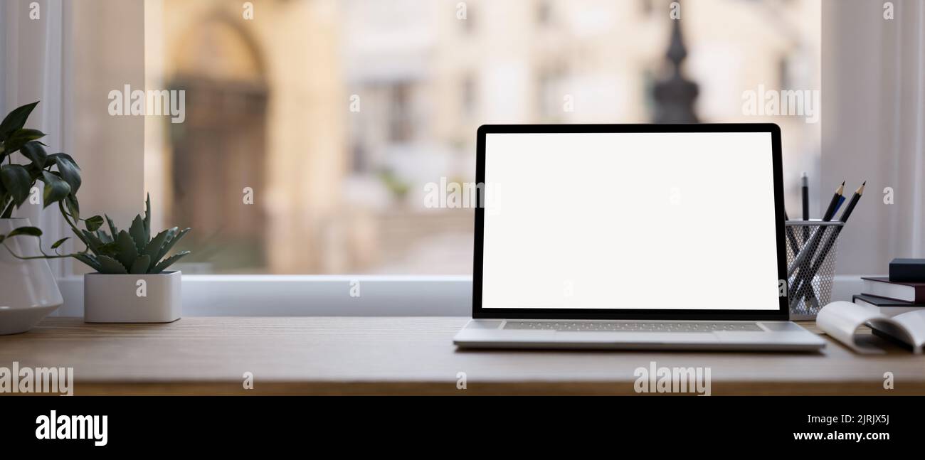 Modern office desk workspace with notebook laptop white screen mockup ...
