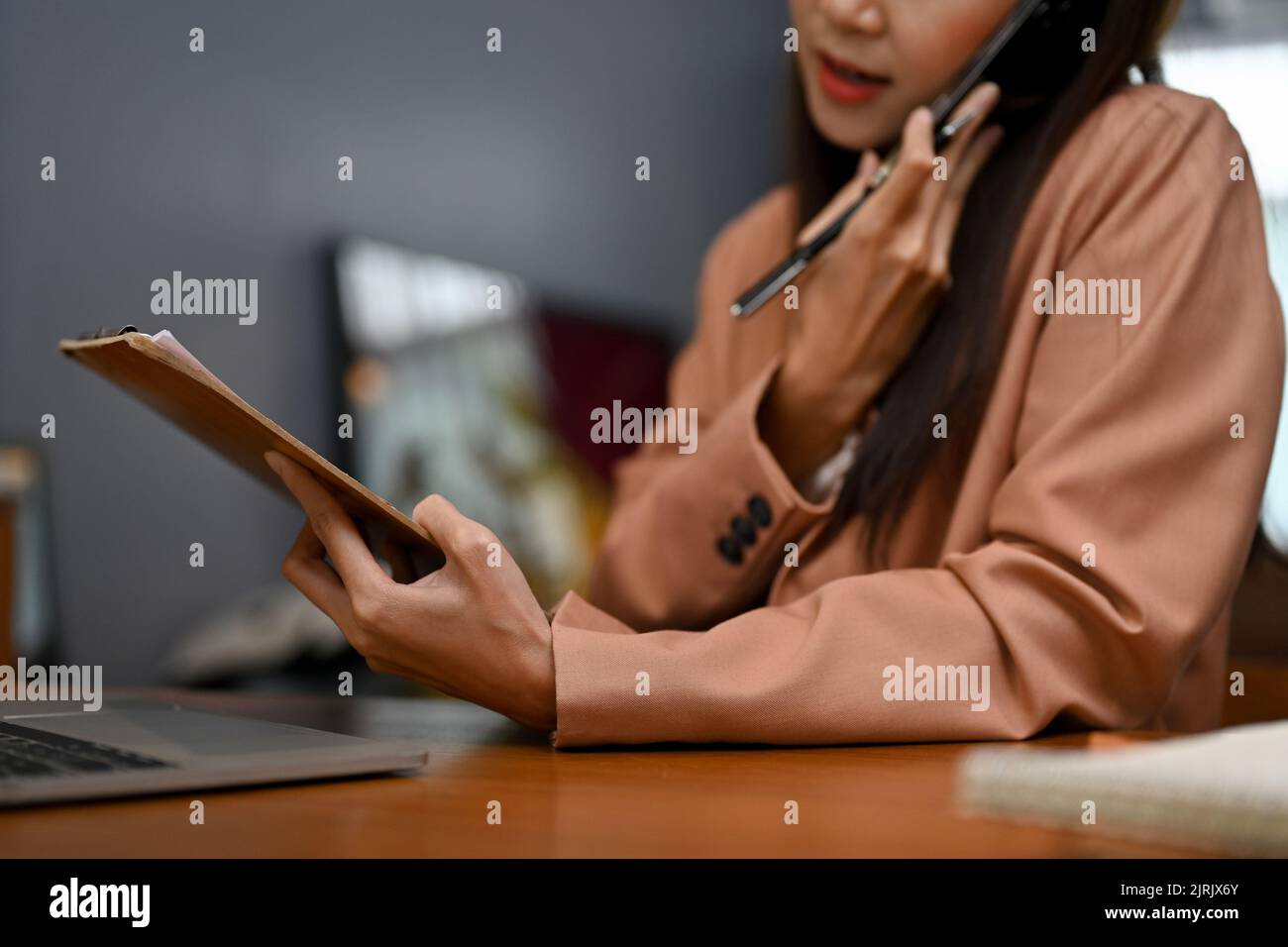 A professional young Asian businesswoman or female secretary looking ...