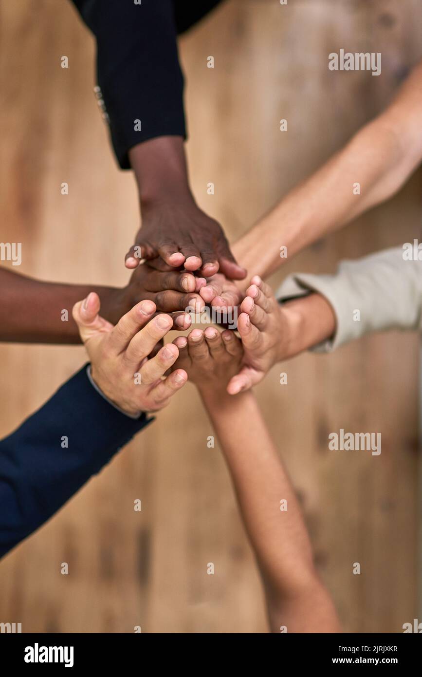 Winners work together. High angle shot of a group of unidentifiable ...