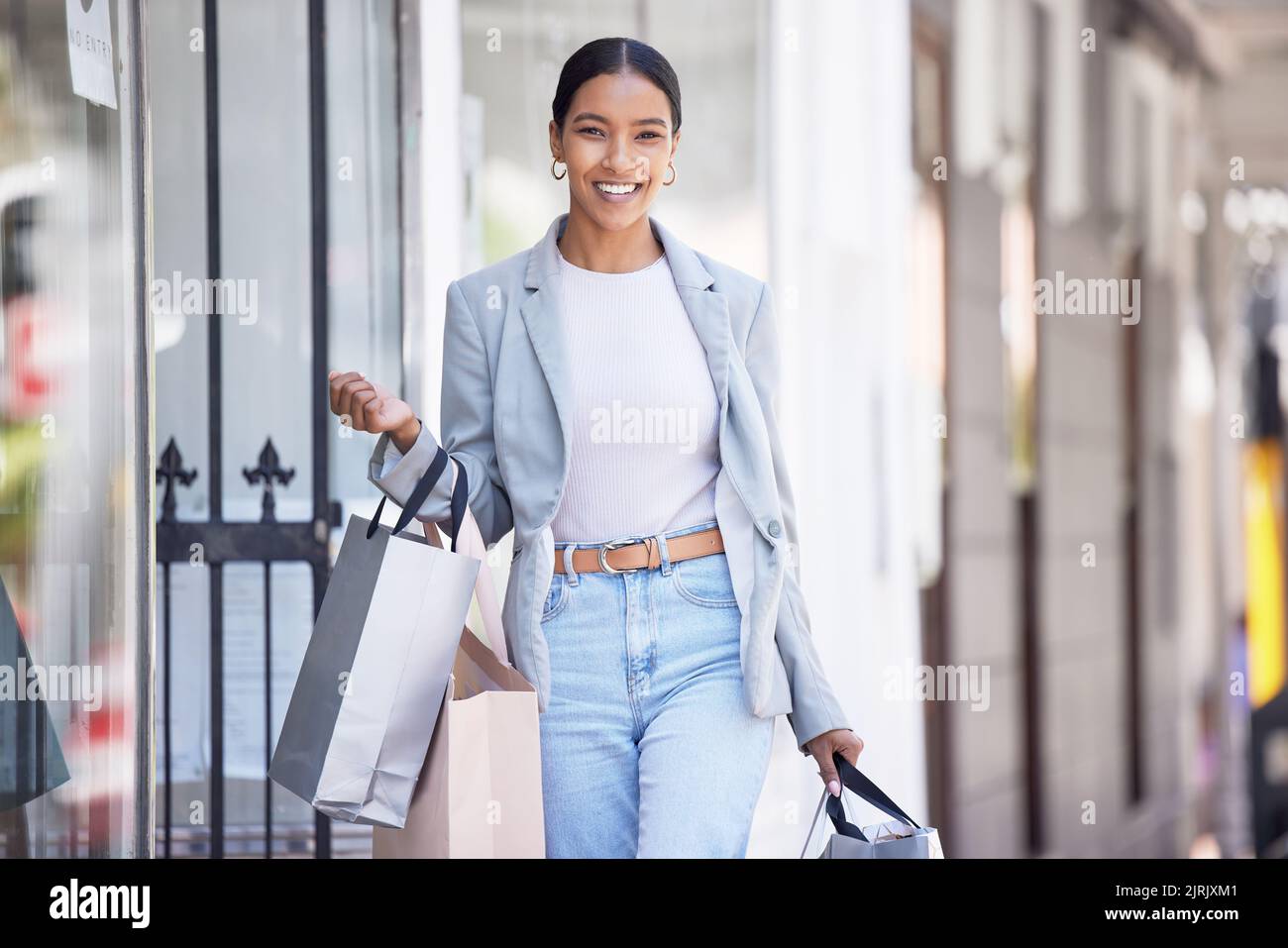 Fashion, retail and shopping with happy black woman excited about a sale, carry bag while ...