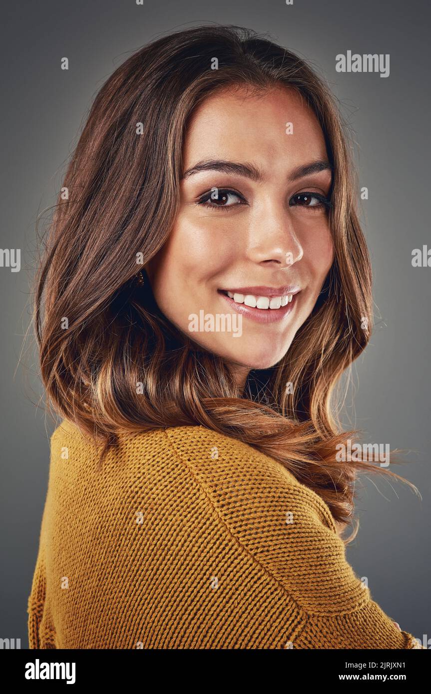 Get up close and personal to beauty. Studio portrait of an attractive ...