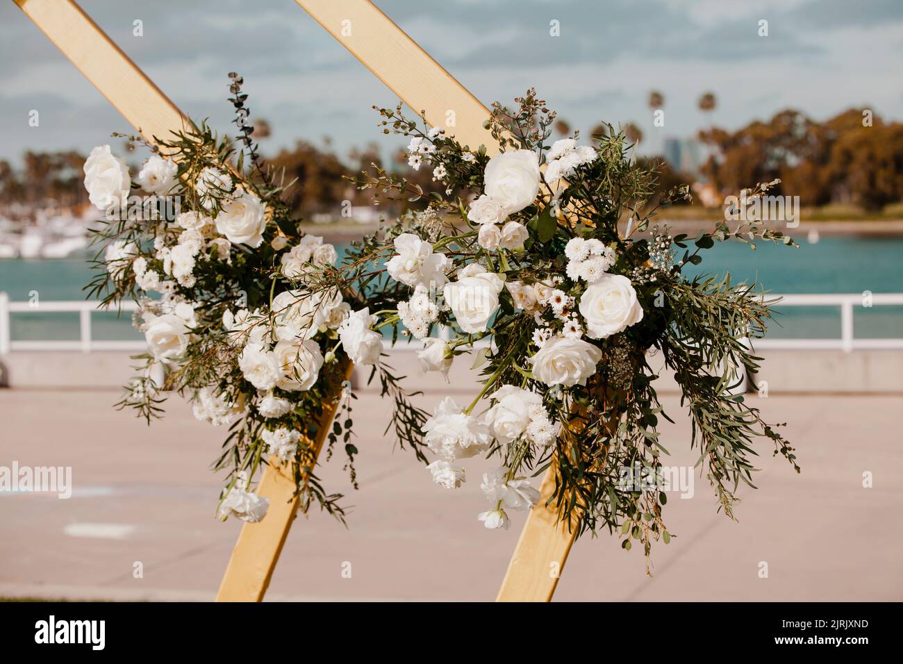 Wedding rhombus double arch with white roses and eucalyptus leaves ...