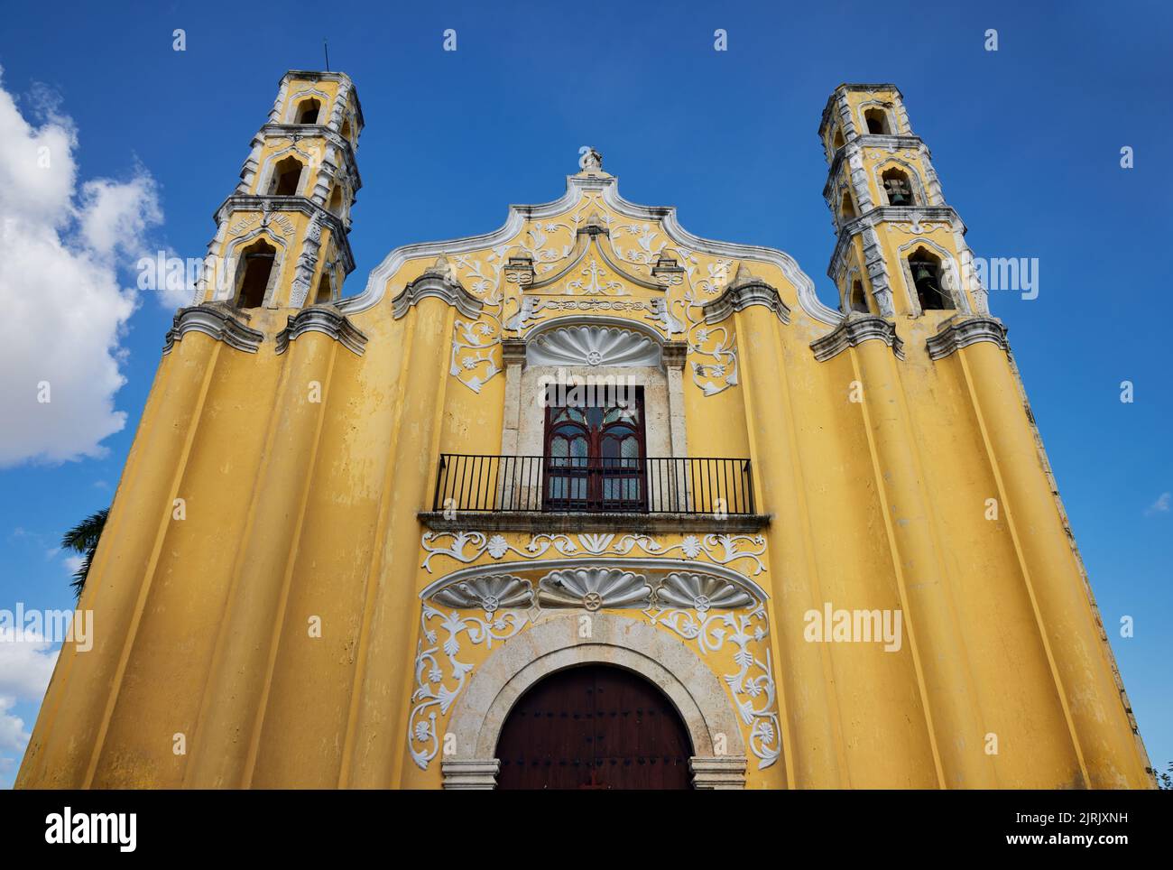 The Saint John Baptist Catholic church under a bright cloudy sky in ...