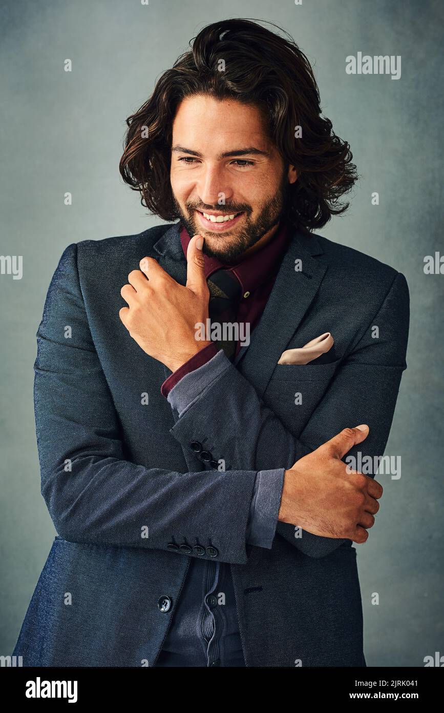 Hes a laid back dude with style. Studio shot of a stylishly dressed ...