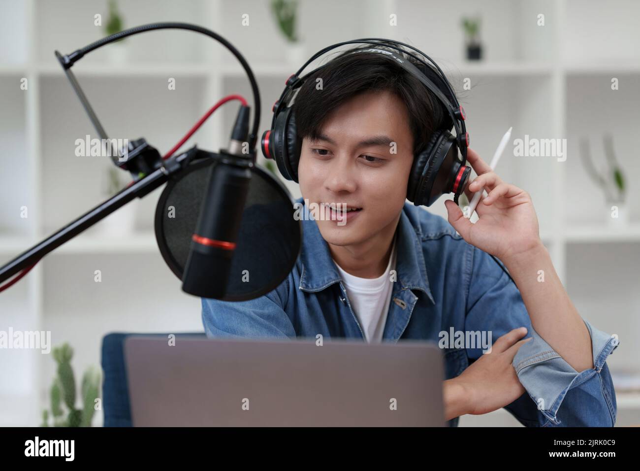 Asian woman recording podcast hi-res stock photography and images - Alamy