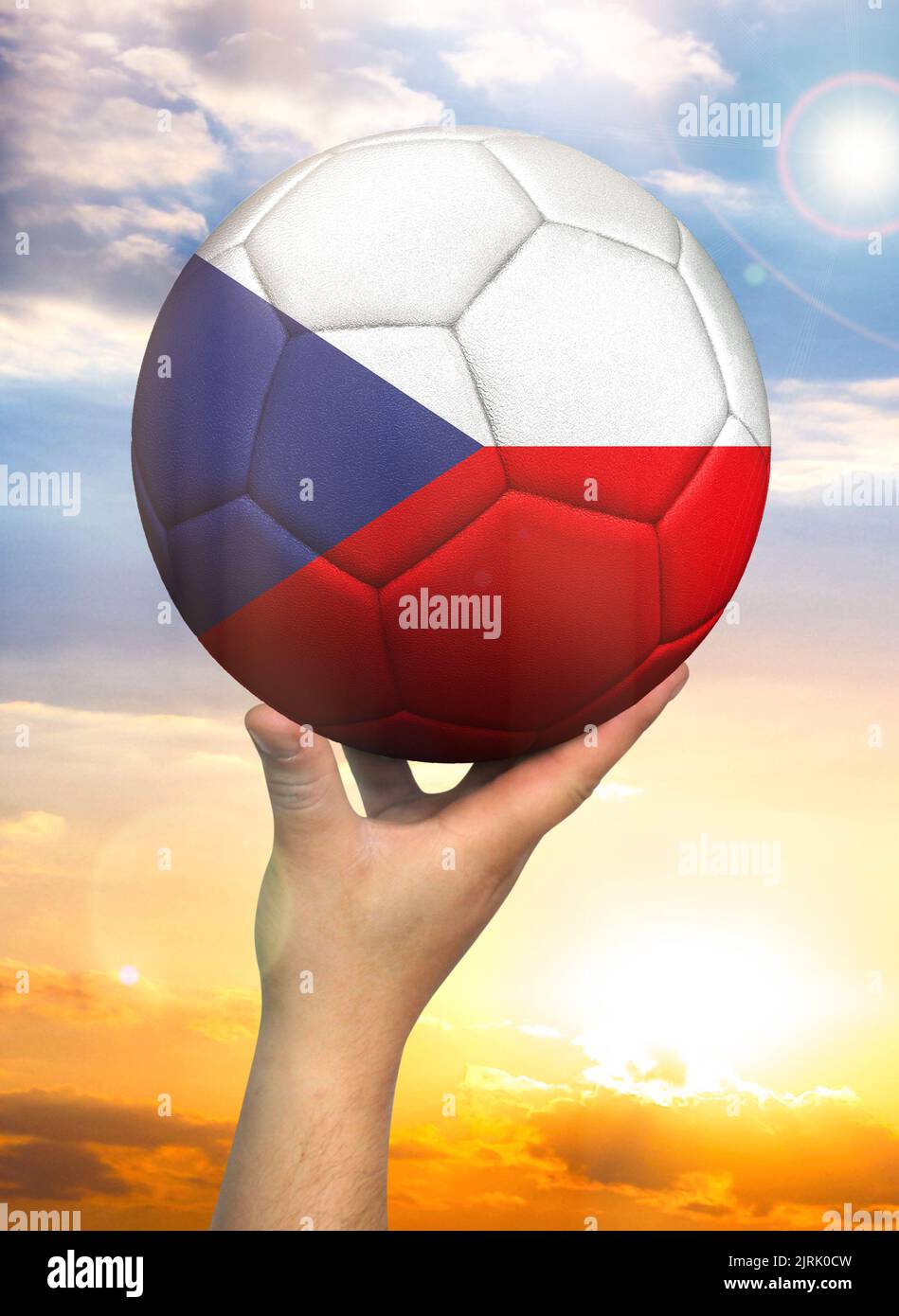 Soccer ball in hand with a depiction of the flag of Czech Republic ...