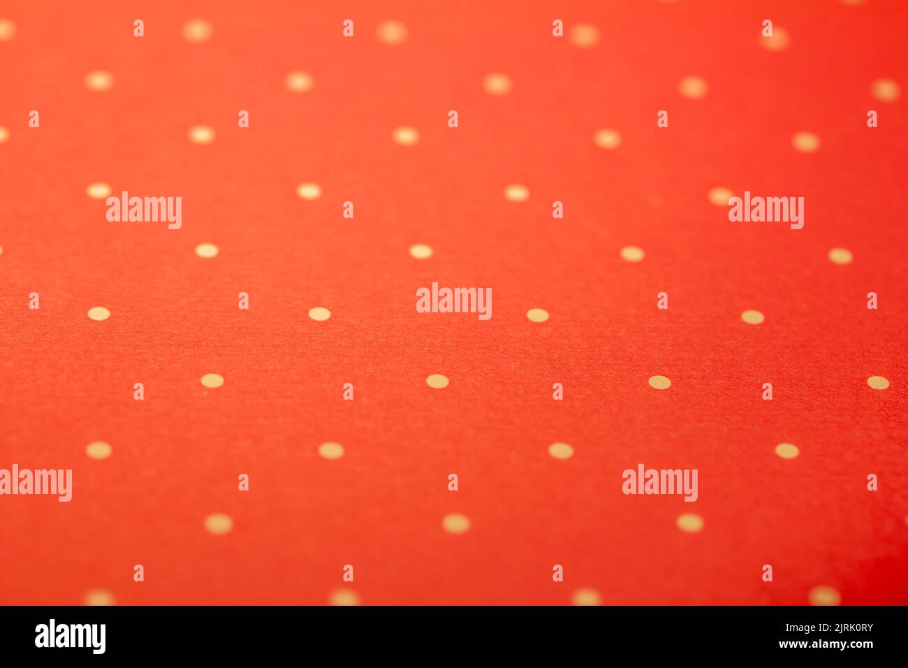 Full frame abstract texture background of solid red and yellow polka ...
