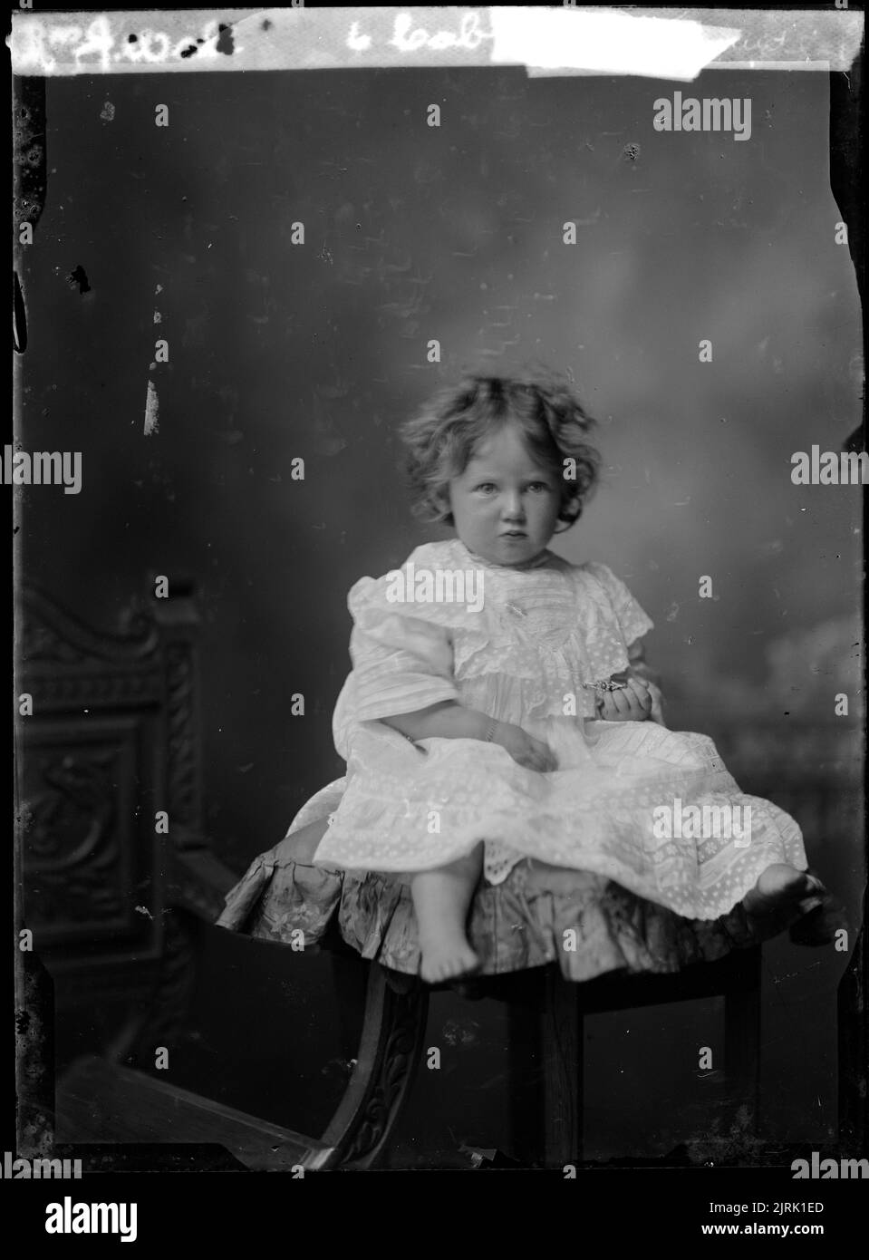 Young girl on a table, 1900-1917, Dannevirke, by Alfred Henderson Stock Photo - Alamy