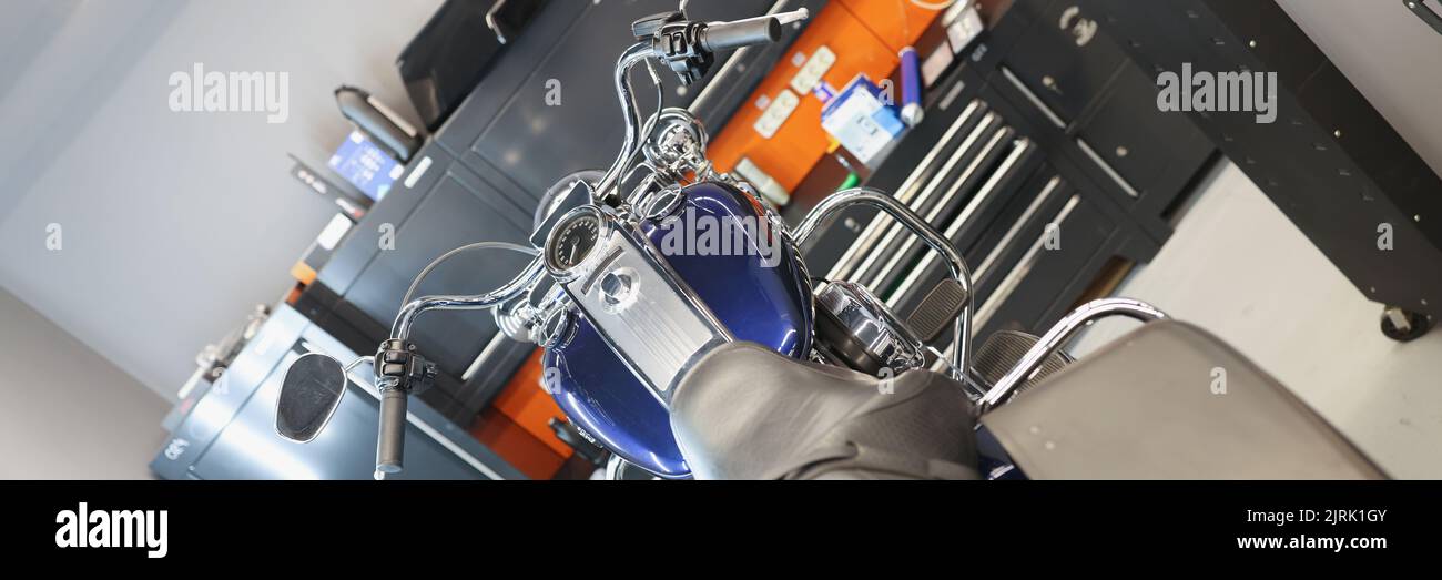 New high-speed motorcycle in blue silver color in garage Stock Photo ...