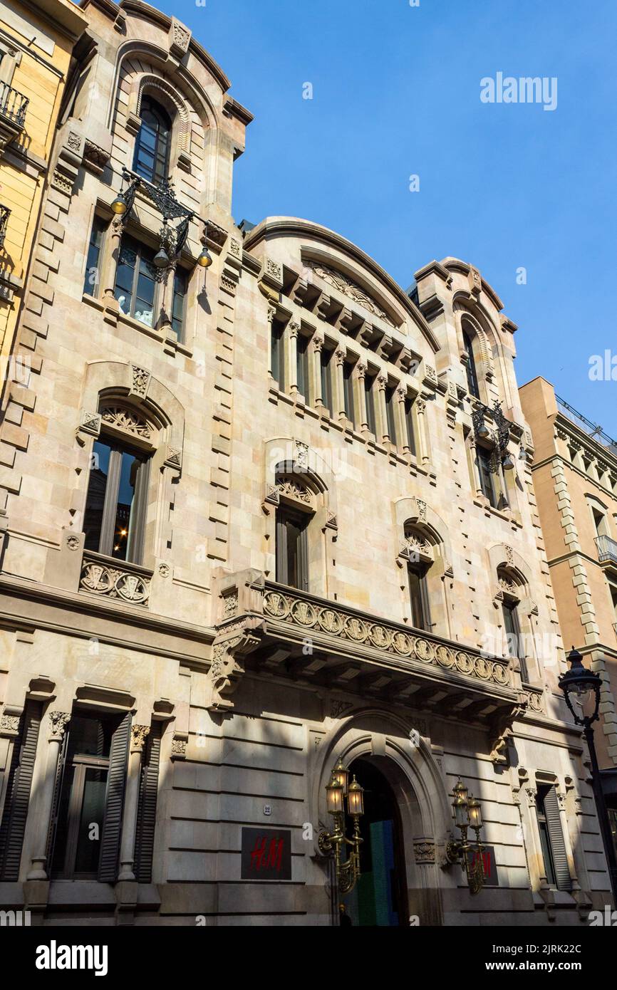 The facade of a historical building in Placa de Catalunya square in ...