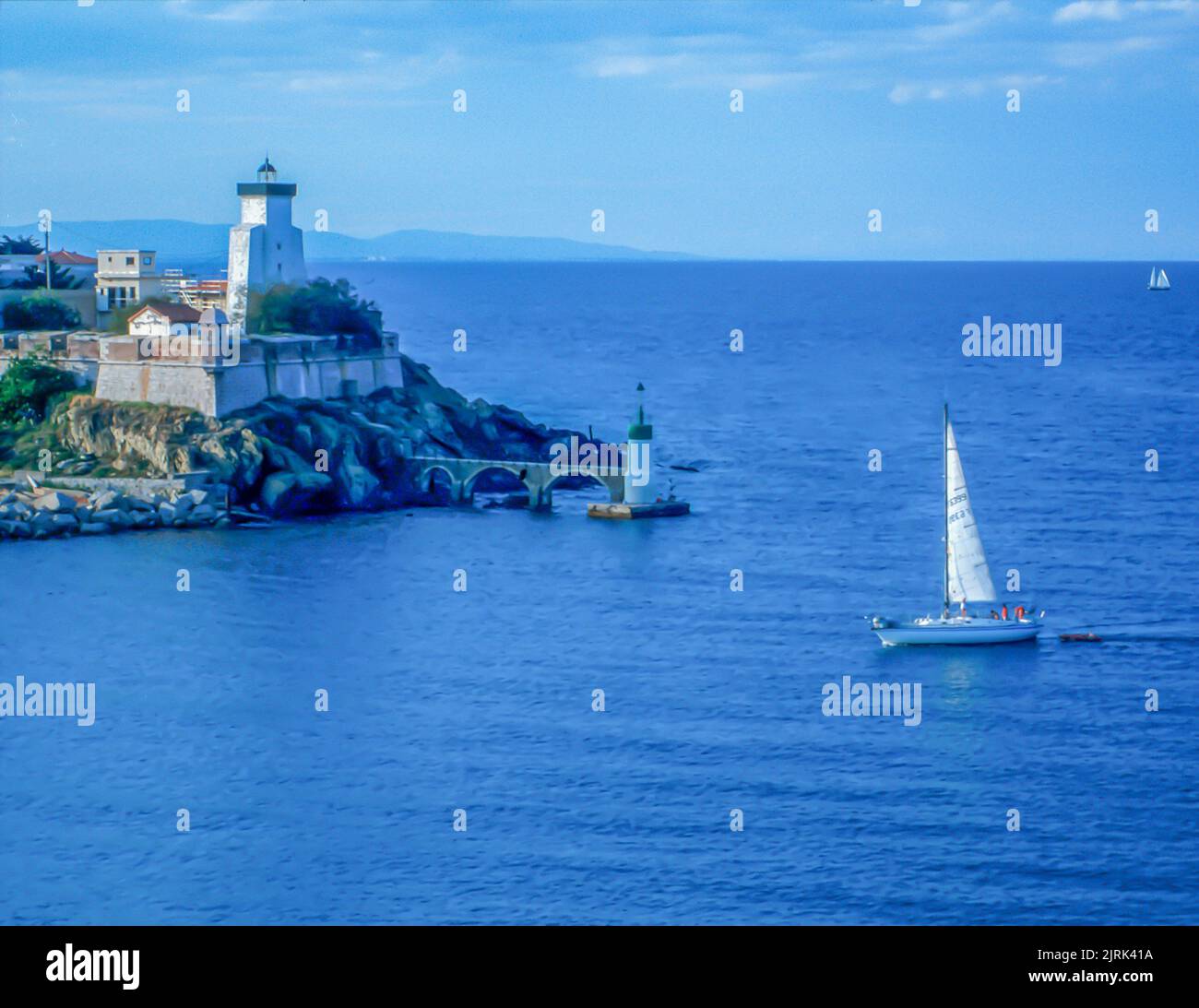 An ancient lighthouse still stands guard at the entrance to Port ...