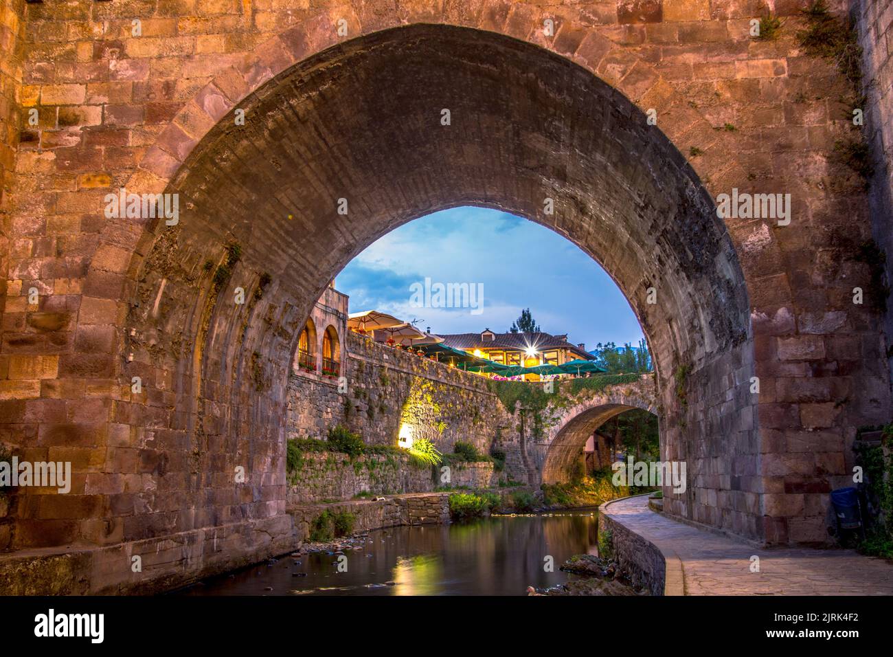 Medieval village of Potes with hanging houses and Deva river, Cantabria ...