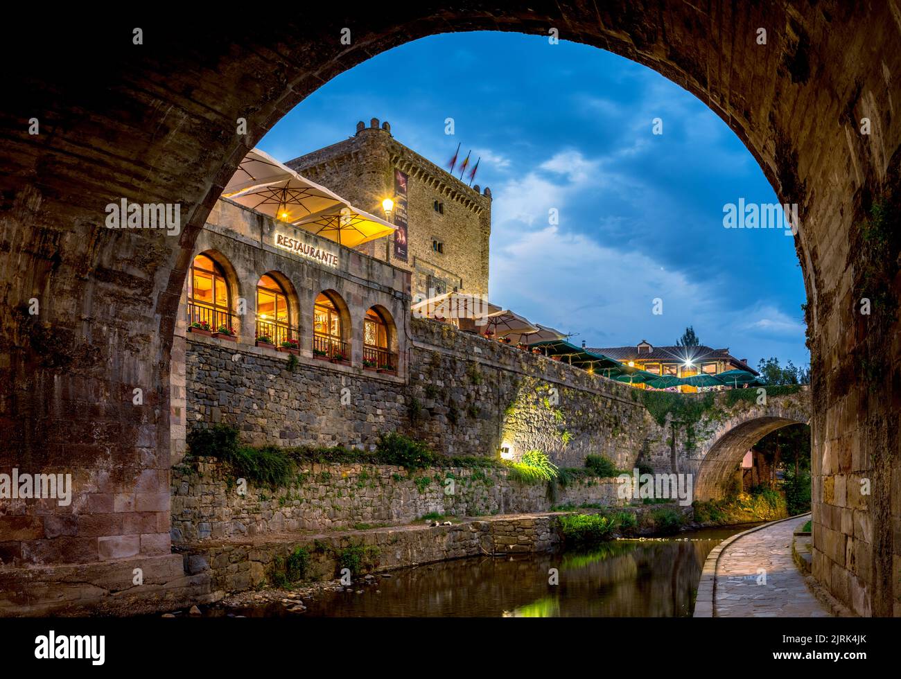 Medieval village of Potes with hanging houses and Deva river, Cantabria ...