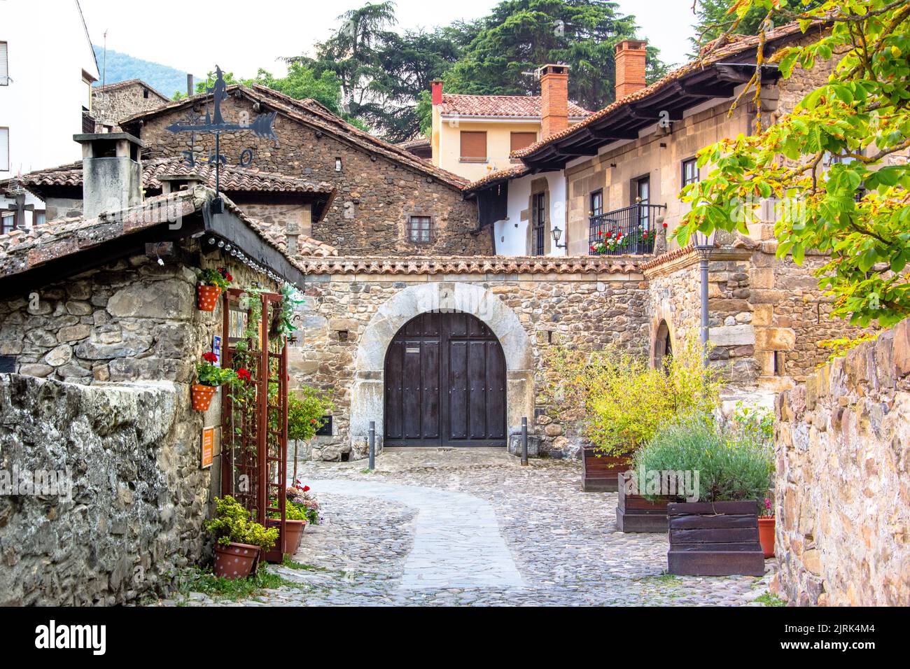 Medieval village of Potes with hanging houses and Deva river, Cantabria ...