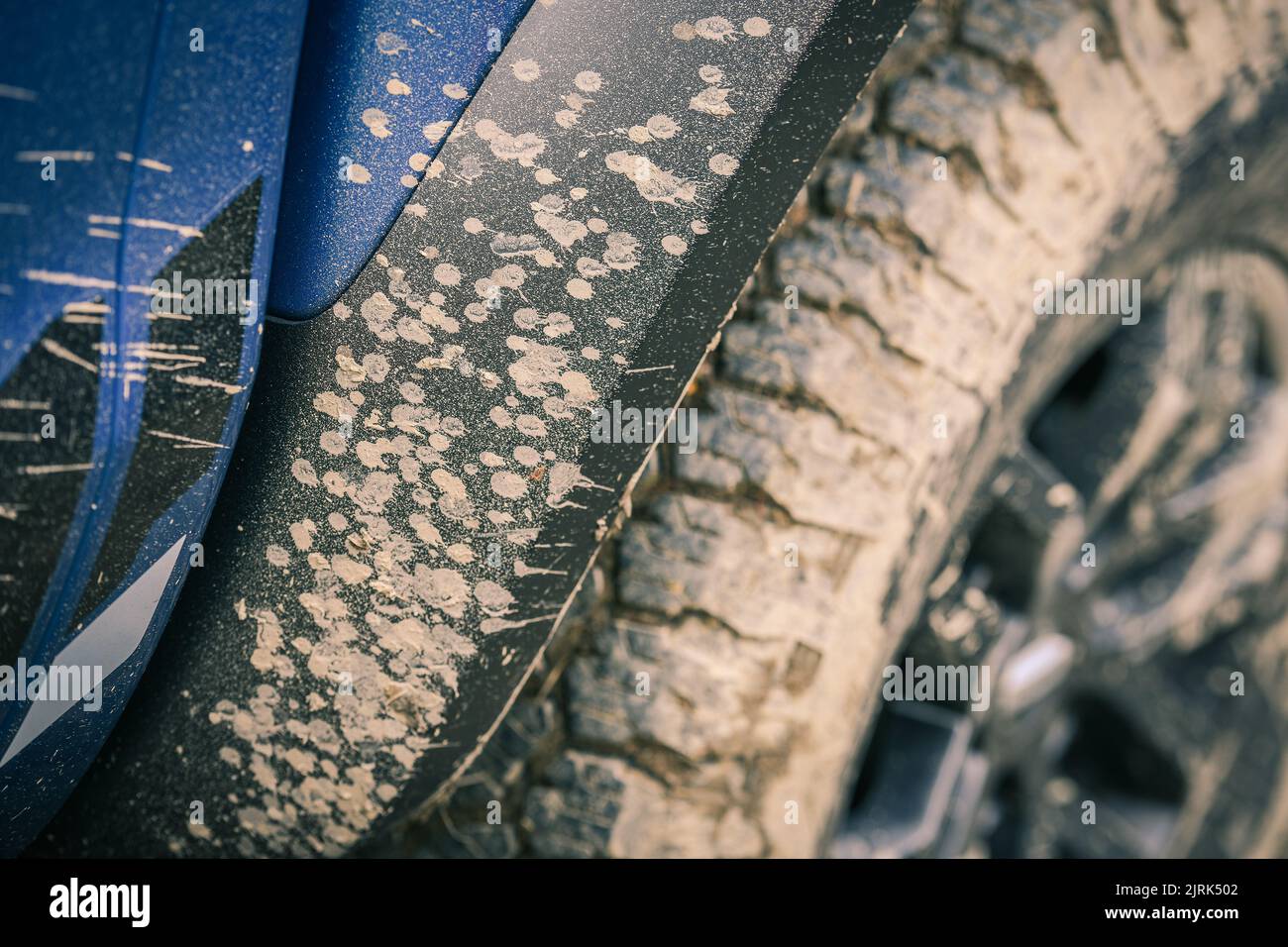 Close-up of a muddy wheel. Big tire of an off-road vehicle with mud ...