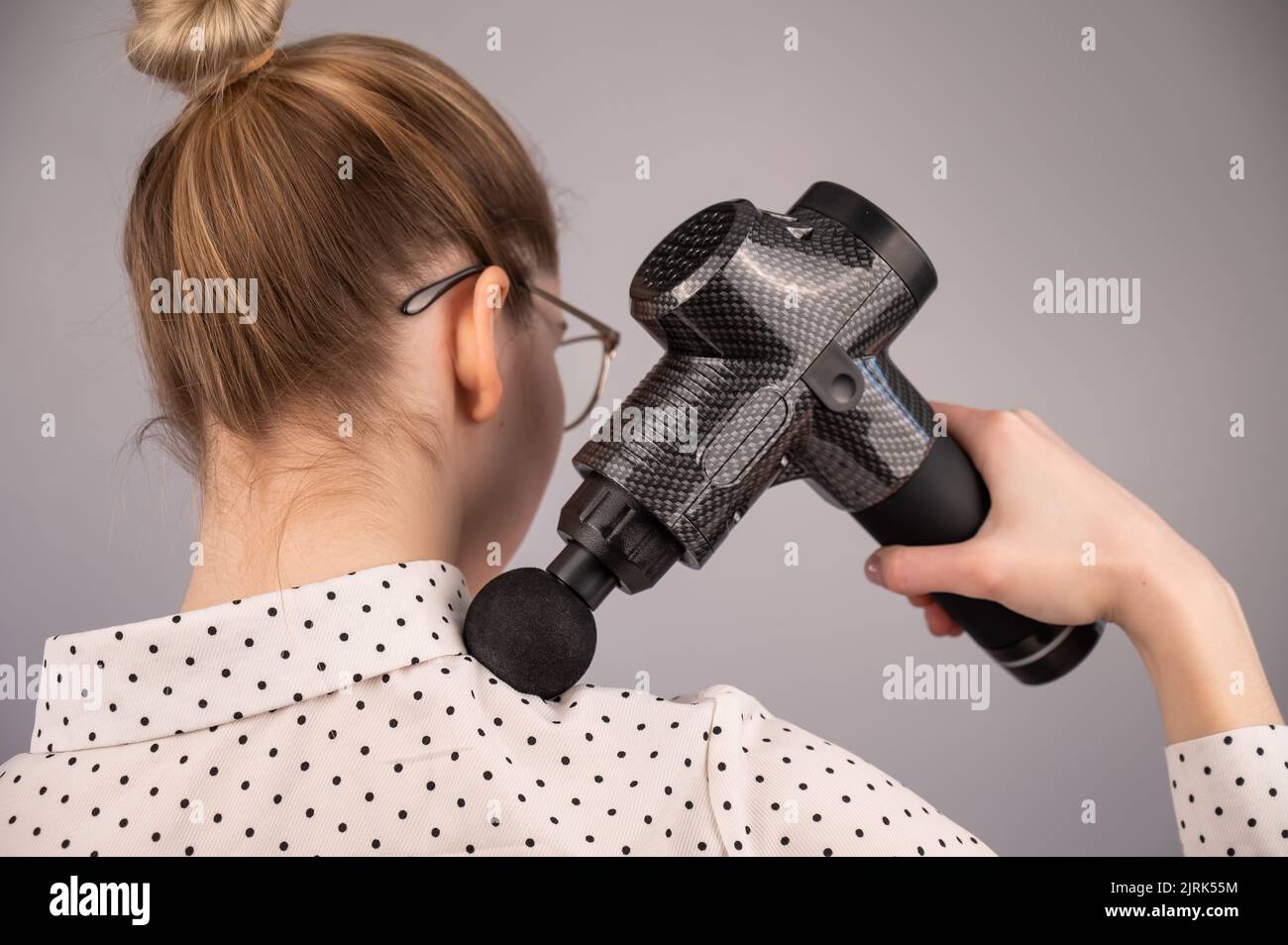 How to use a massage gun for recovery hi-res stock photography and ...
