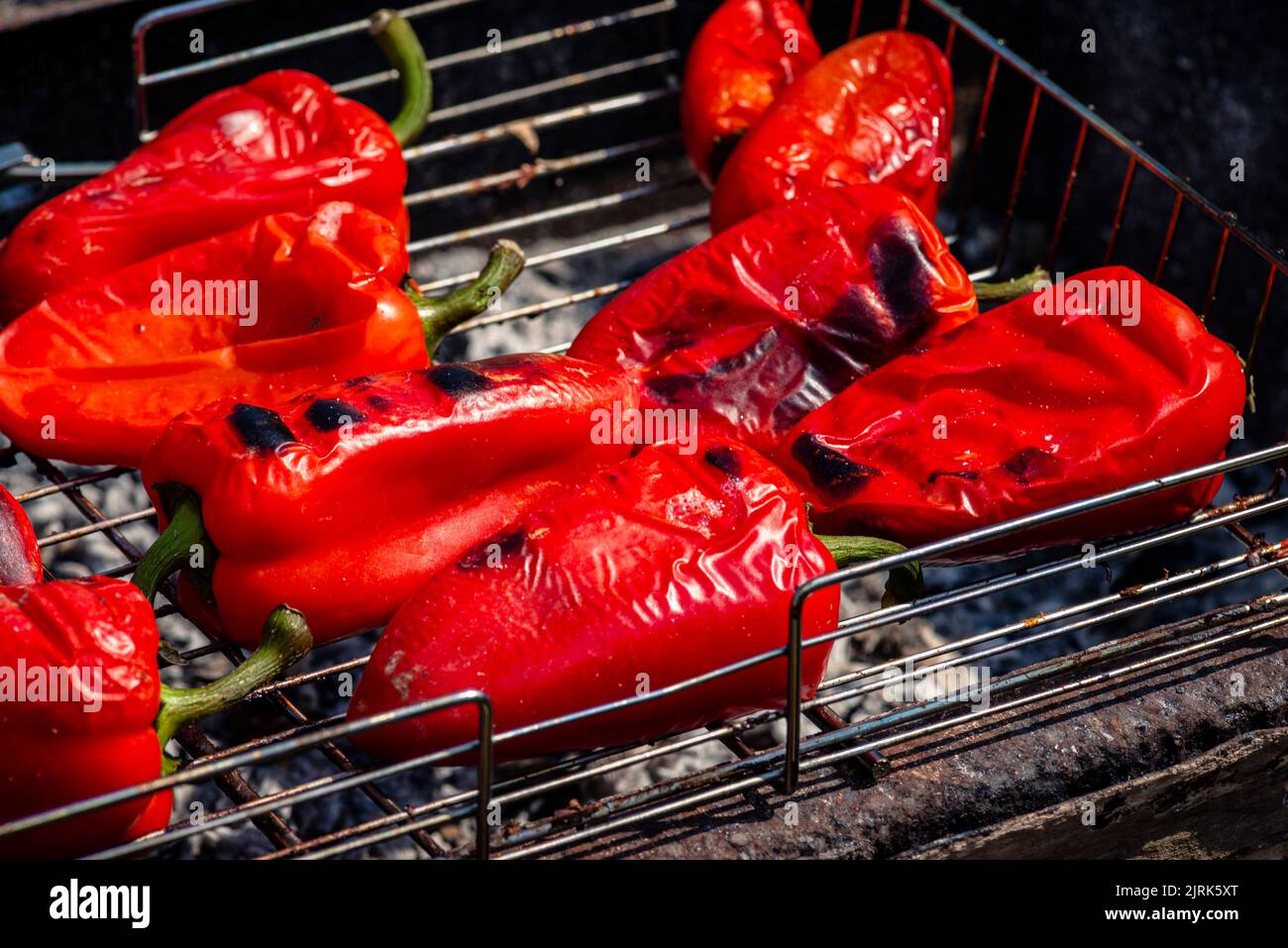 Grilling Process of preparing red bell pepper on barbecue bbq grill ...
