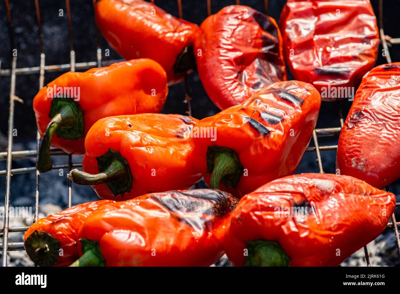 Grilling Process of preparing red bell pepper on barbecue bbq grill ...
