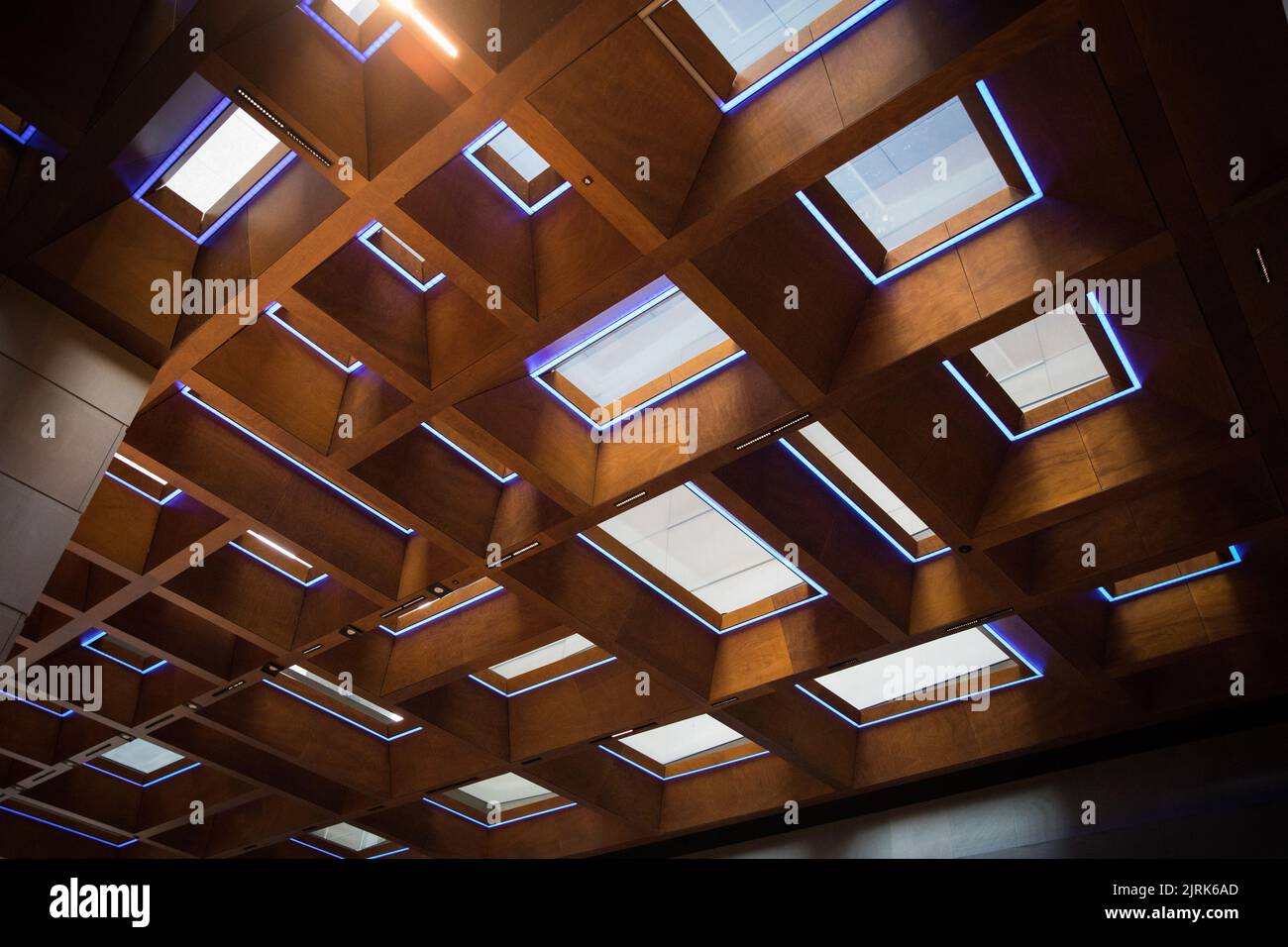 A low angle shot of a modern ceiling design for an office interior ...