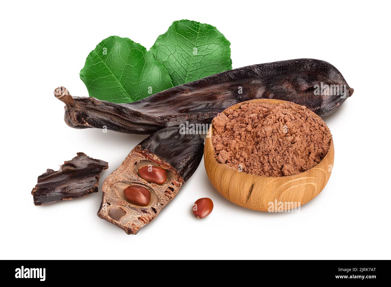 Carob pod and powder in wooden bowl isolated on white background with ...