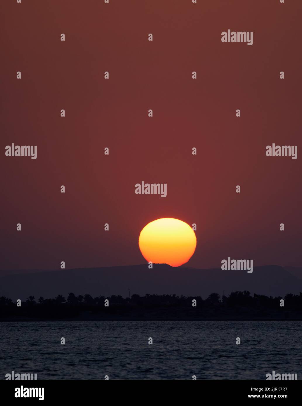 A beautiful view of sea against the moon in La Paz, Baja California Sur ...