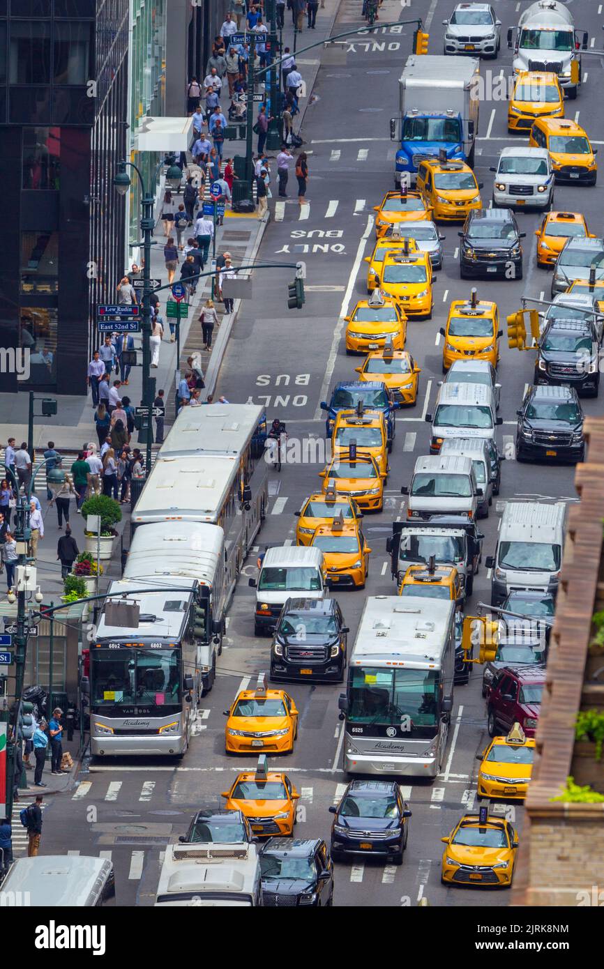 Yellow taxi cabs and 9am peak hour traffic in Midtown Manhattan on ...