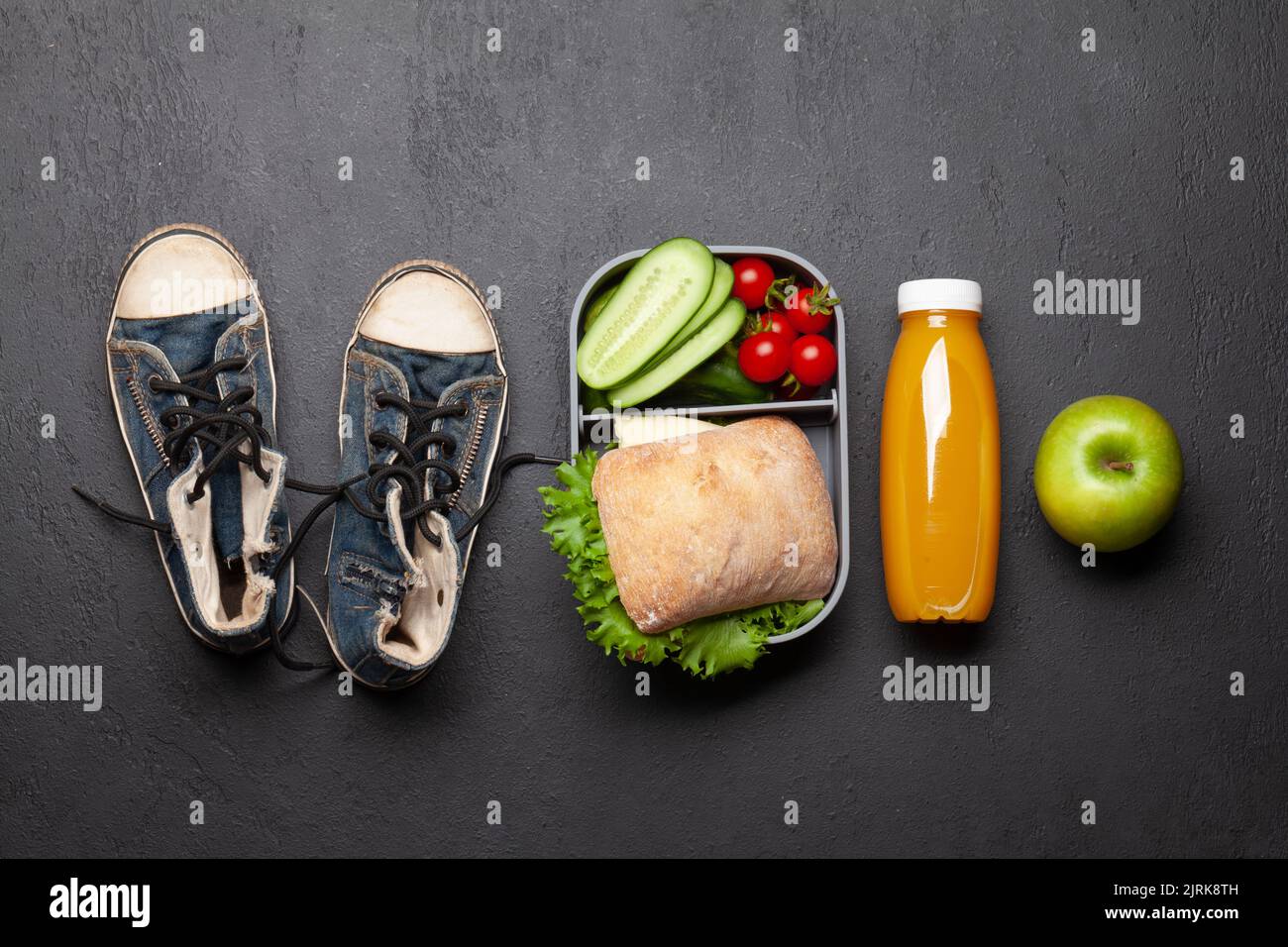 Lunch box with sandwich, vegetables and juice. School or office meal ...