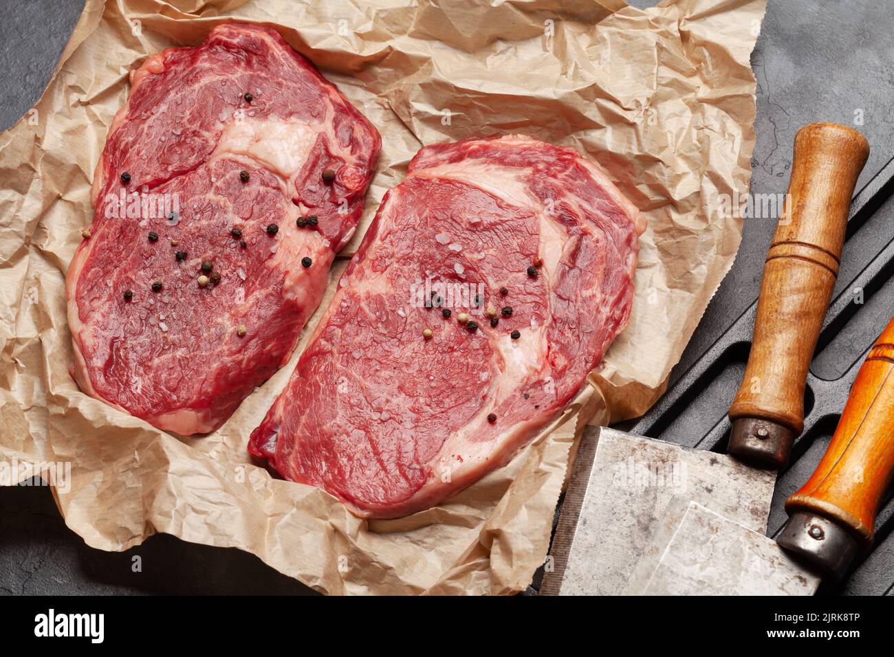 Two raw ribeye beef steaks. Top view Stock Photo - Alamy