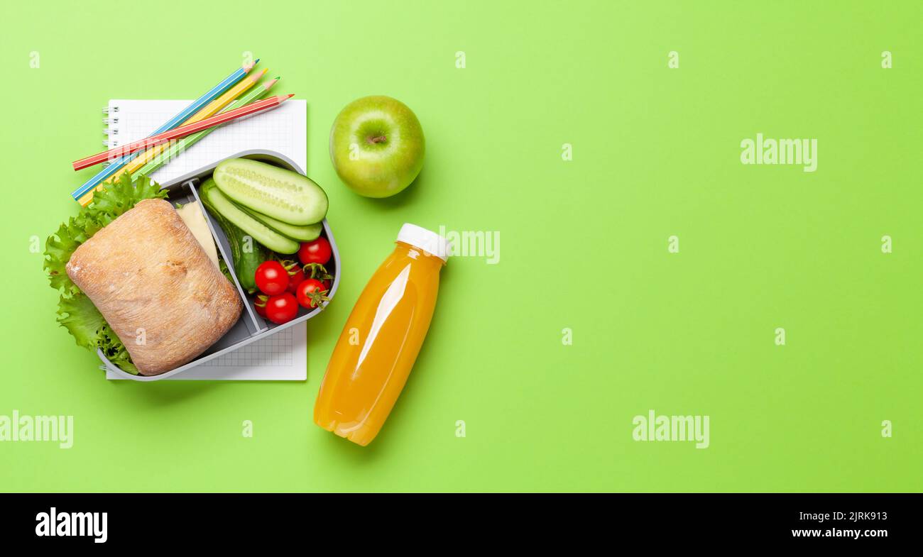 Lunch box with sandwich, vegetables and juice. School or office meal ...