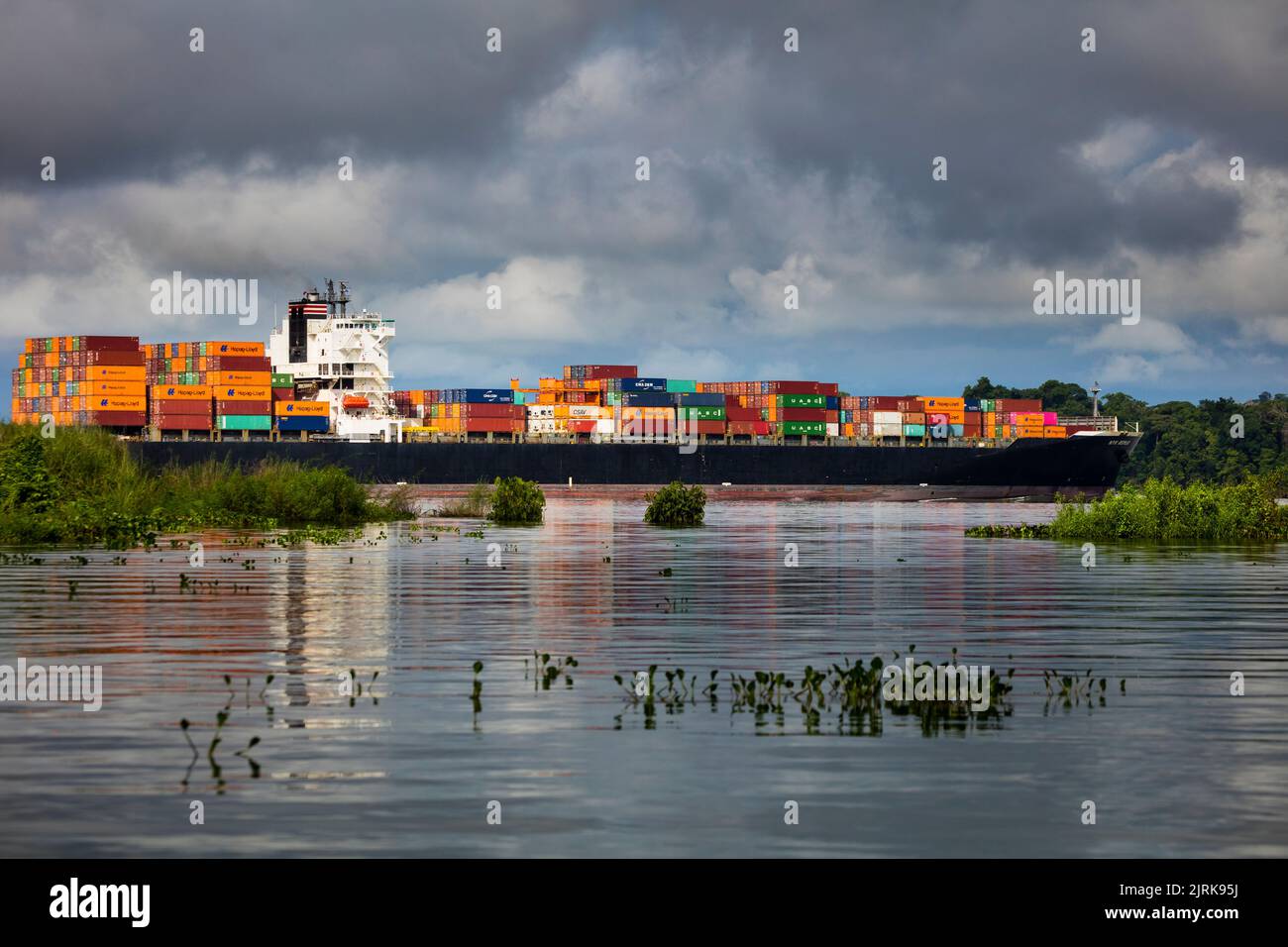 Panama Canal landscape with the container ship Nyk Remus in transit ...