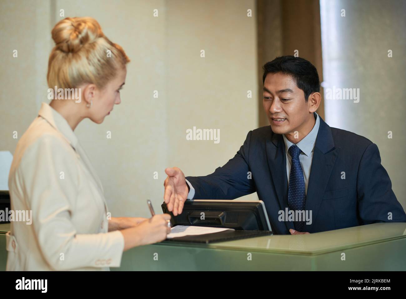 Receptionist asian office hi-res stock photography and images - Alamy