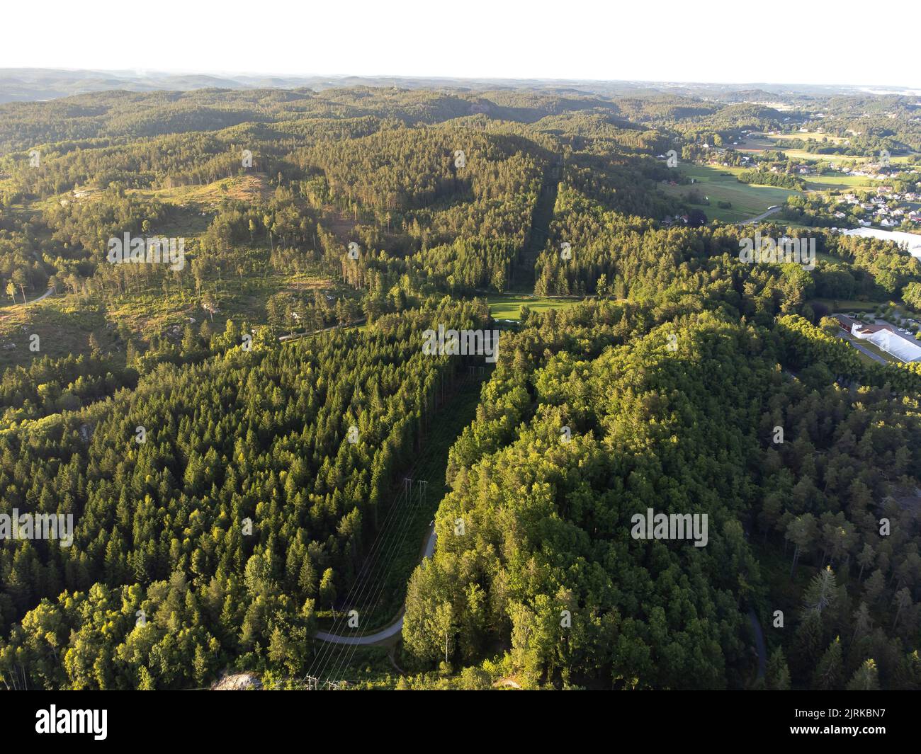 An aerial view of lush green coastal forests in Grimstad, Norway Stock ...
