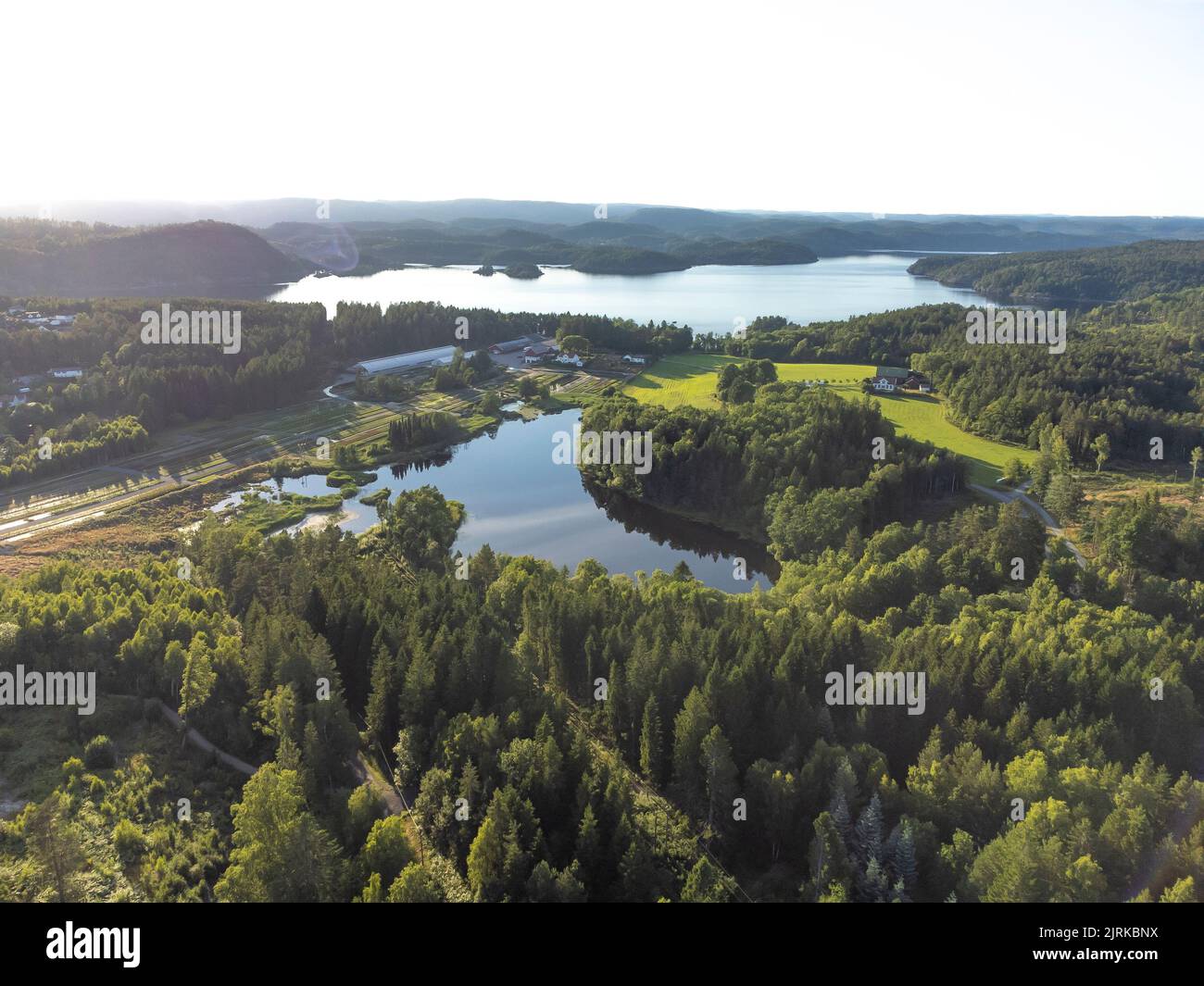 An aerial view of lush green coastal forests in Grimstad, Norway Stock ...