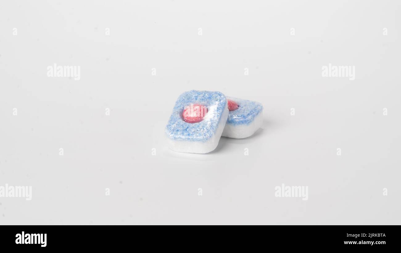 Detergent in dishwasher tablets on a white background Stock Photo - Alamy