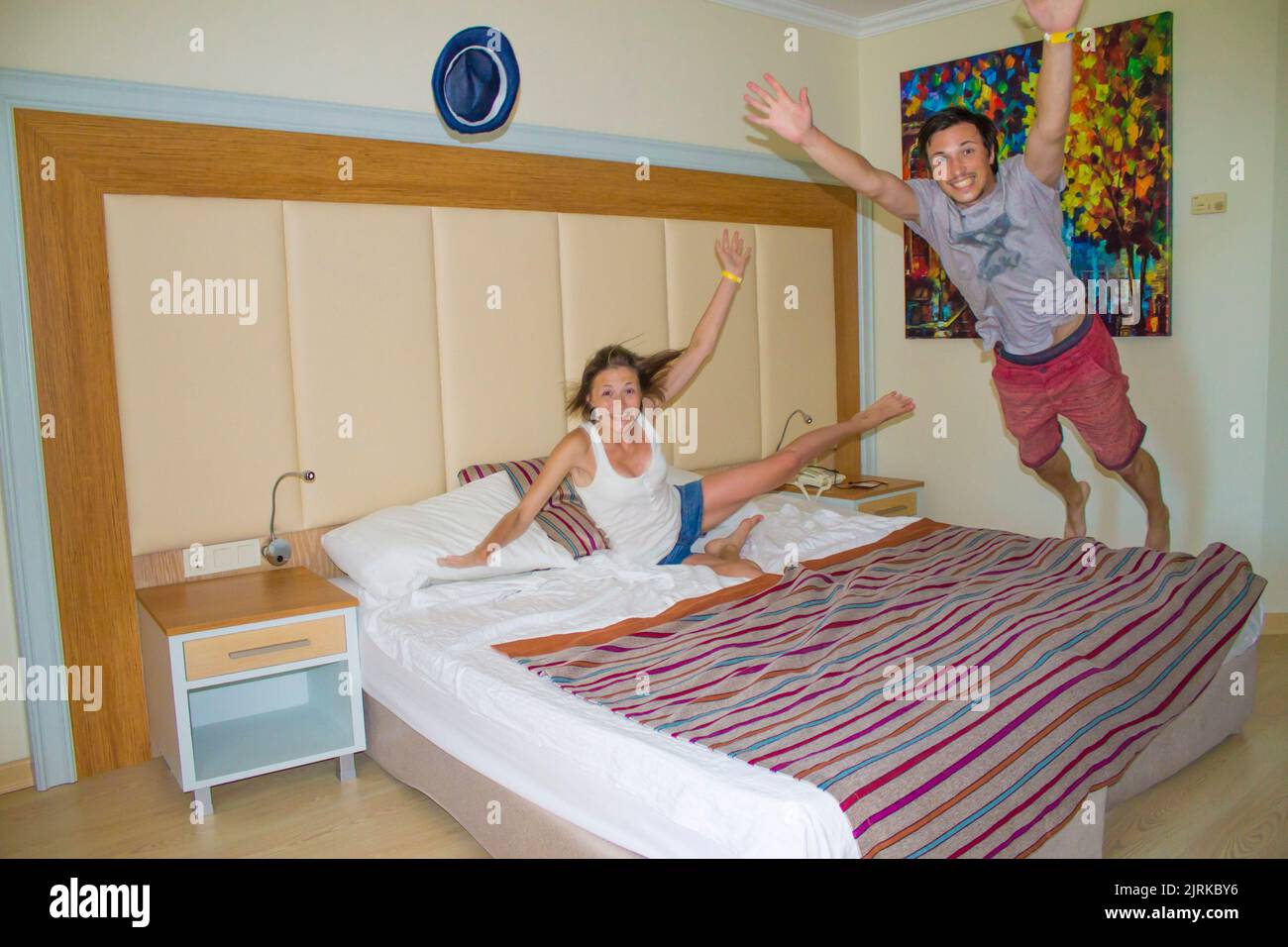 Hotel children jumping on bed hi-res stock photography and images - Alamy