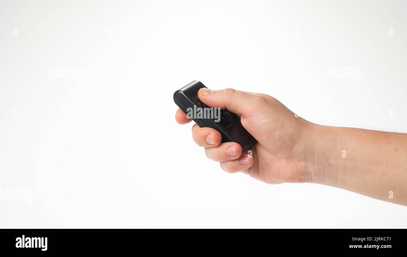 Mans hand holds control hi-res stock photography and images - Alamy