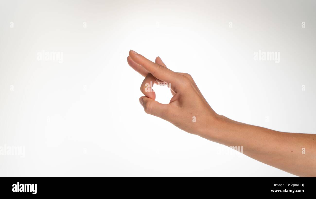 Female hand gesture clicking on forehead on white background. High ...