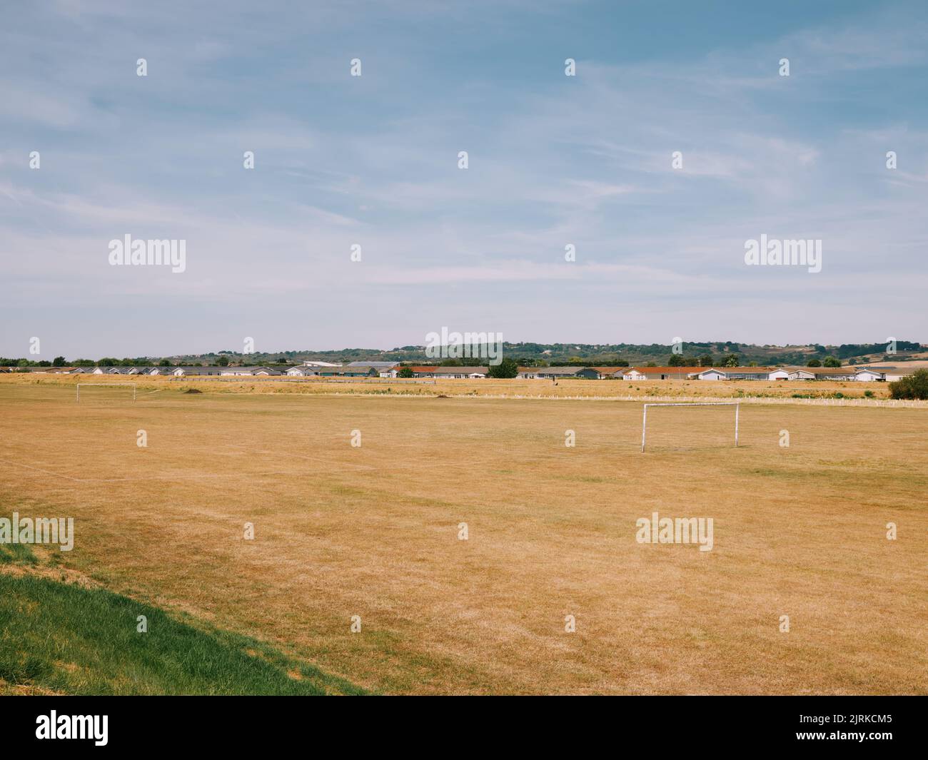 Smallgains public football pitch playing fields with brown dry grass in ...