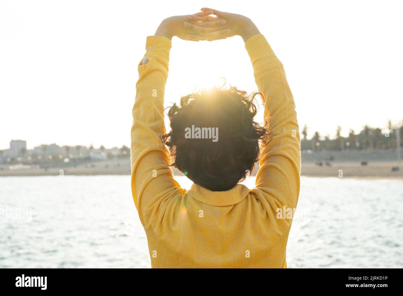 Woman raising hands above head hi-res stock photography and images - Alamy