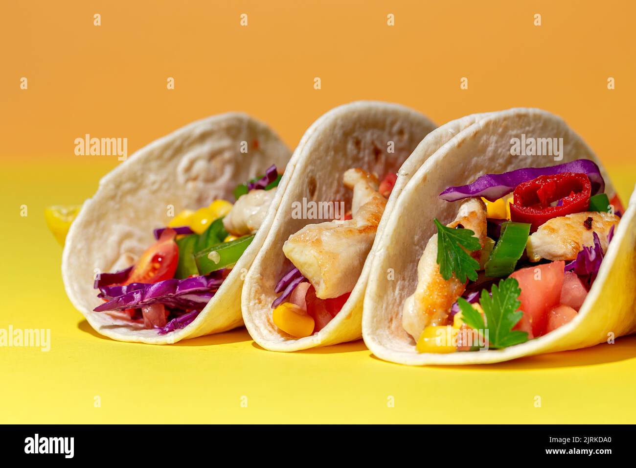 Homemade Mexican Tacos with fresh vegetables and chicken with strong ...