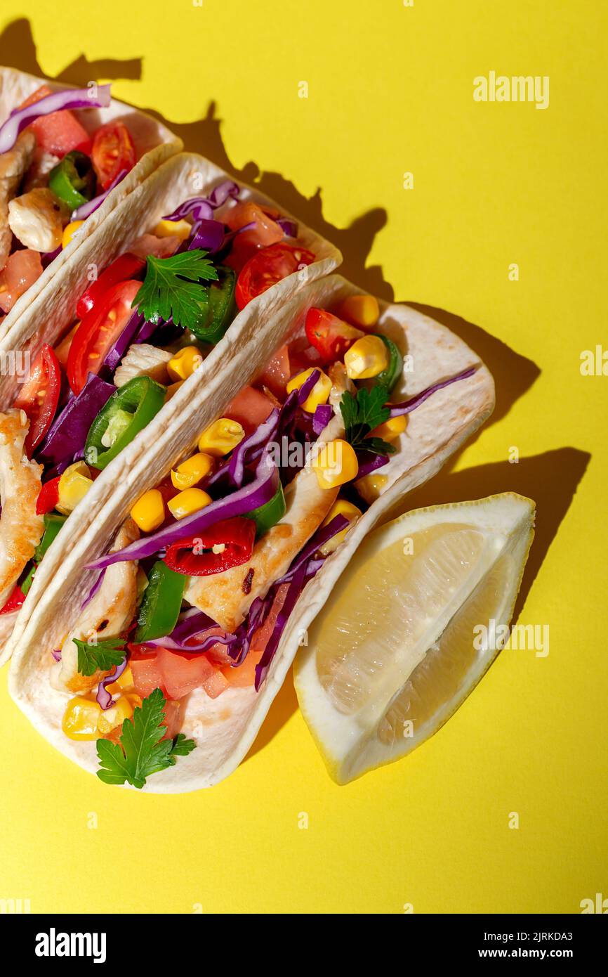 Homemade Mexican Tacos with fresh vegetables and chicken with strong ...