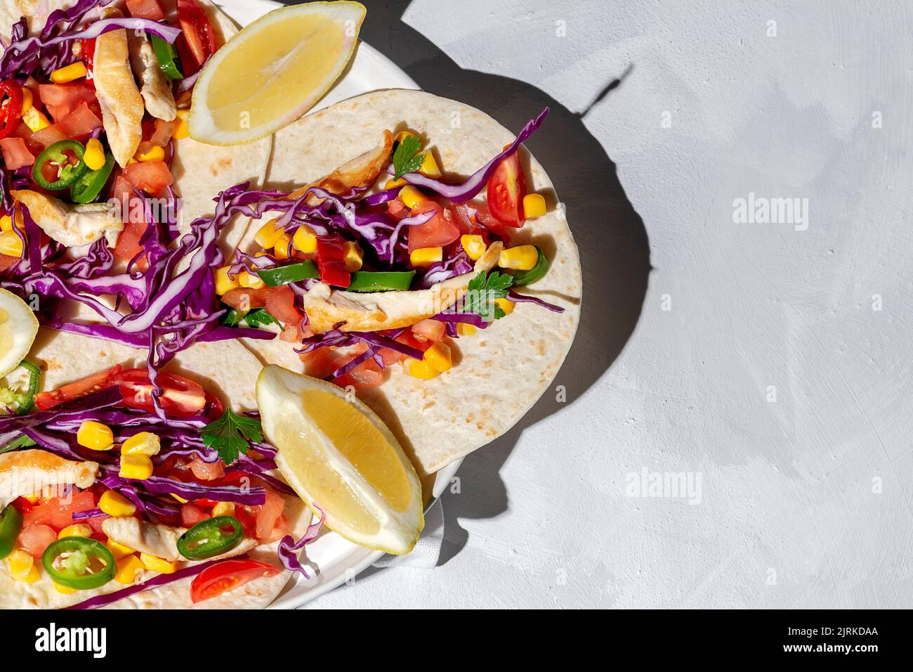 Homemade Mexican Tacos with fresh vegetables and chicken with strong ...