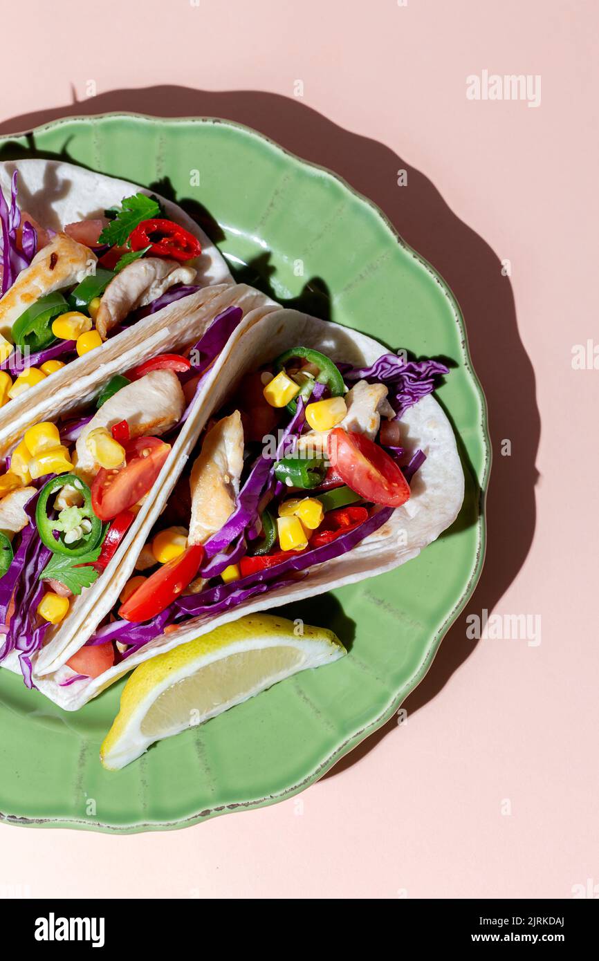 Homemade Mexican Tacos with fresh vegetables and chicken with strong ...