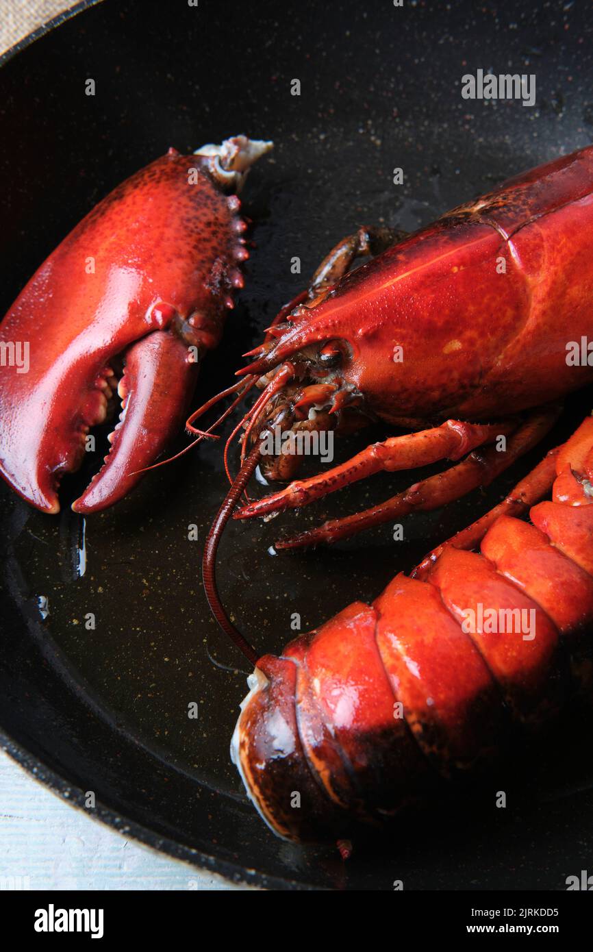 Raw lobster in sauce pan prepared for being grilled Stock Photo - Alamy