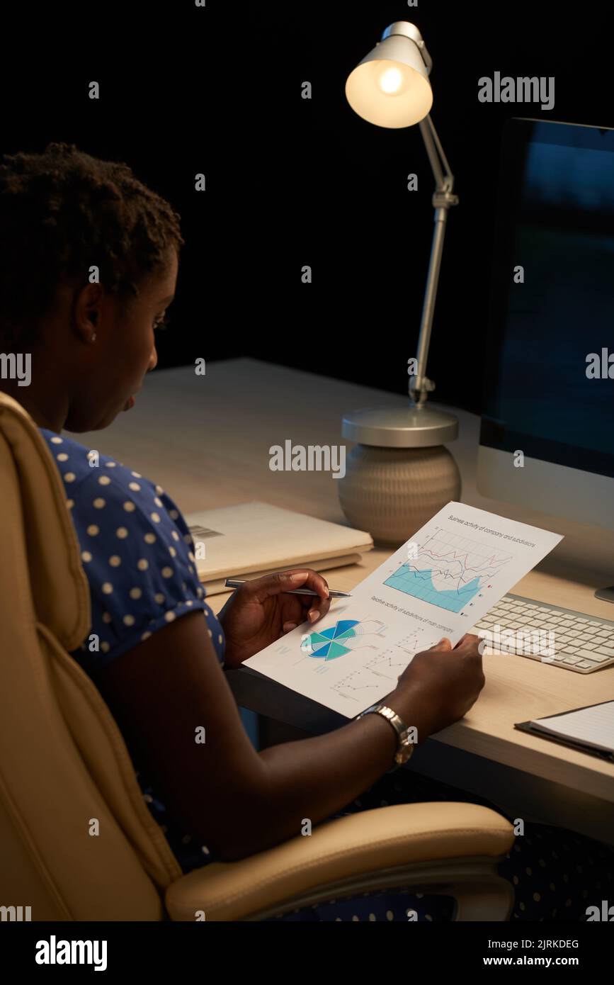 Female business executive analyzing chart with financial data Stock ... Female business executive analyzing chart with financial data Stock ...